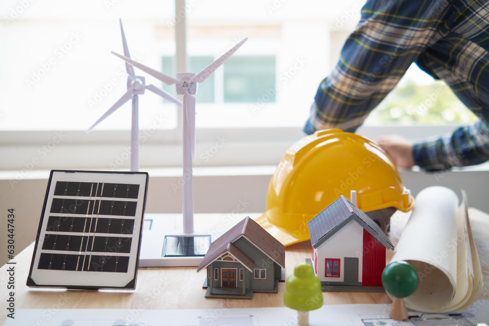 team of renewable energy engineers are talking to architects to make ...