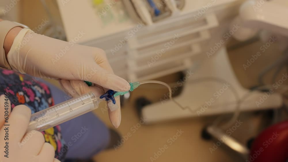 Injection of a catheter of a patient. Anesthesiologist or doctor put ...