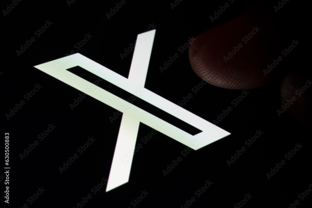 Twitter X app logo seen on screen of smartphone. Twitter rebrands as X ...