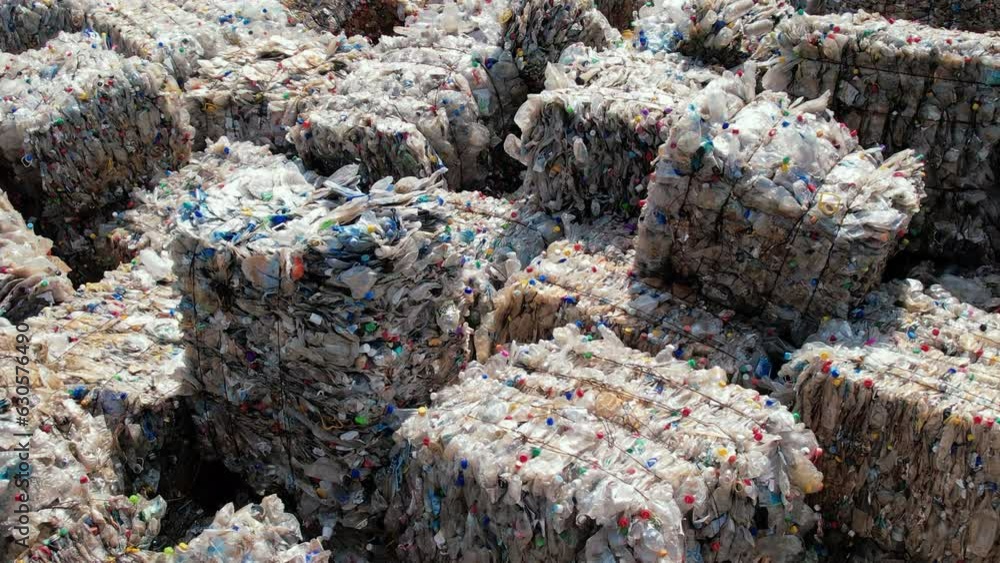 Multiple cubes of compressed plastic garbage at waste recycling factory ...