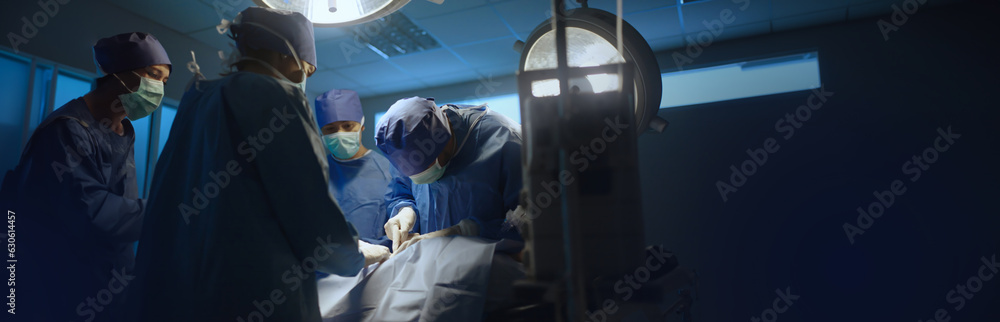 Medical Team Performing Surgical Operation in Modern Operating Room ...