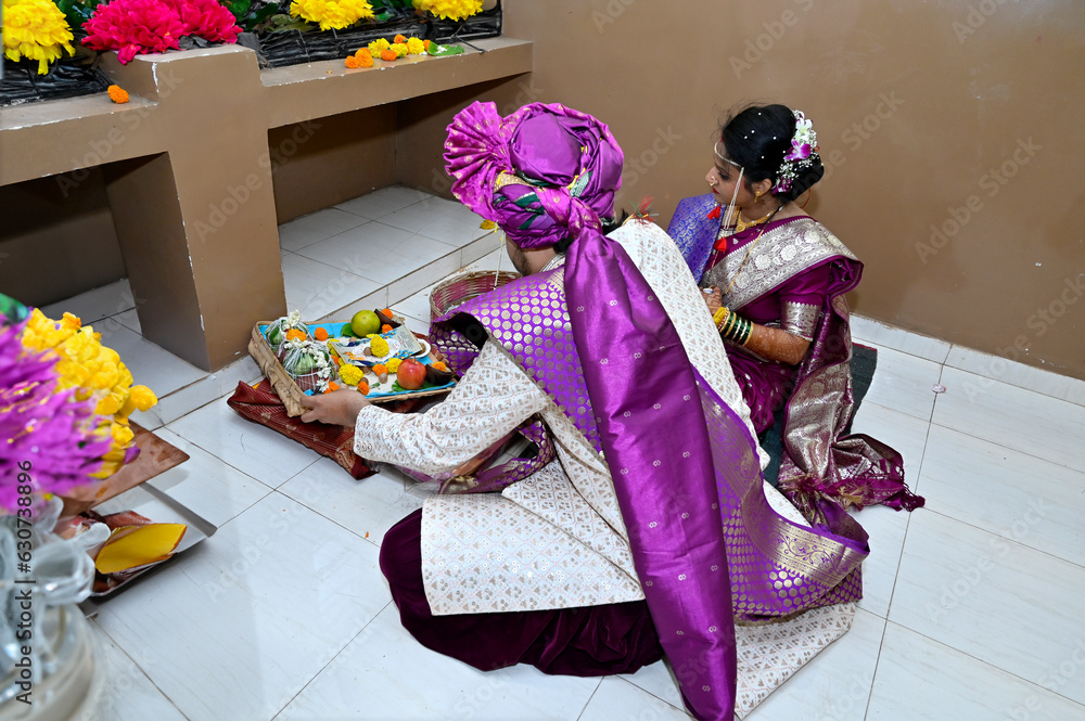 Bride and Groom in wedding worship. Marathi wedding ceremony ...