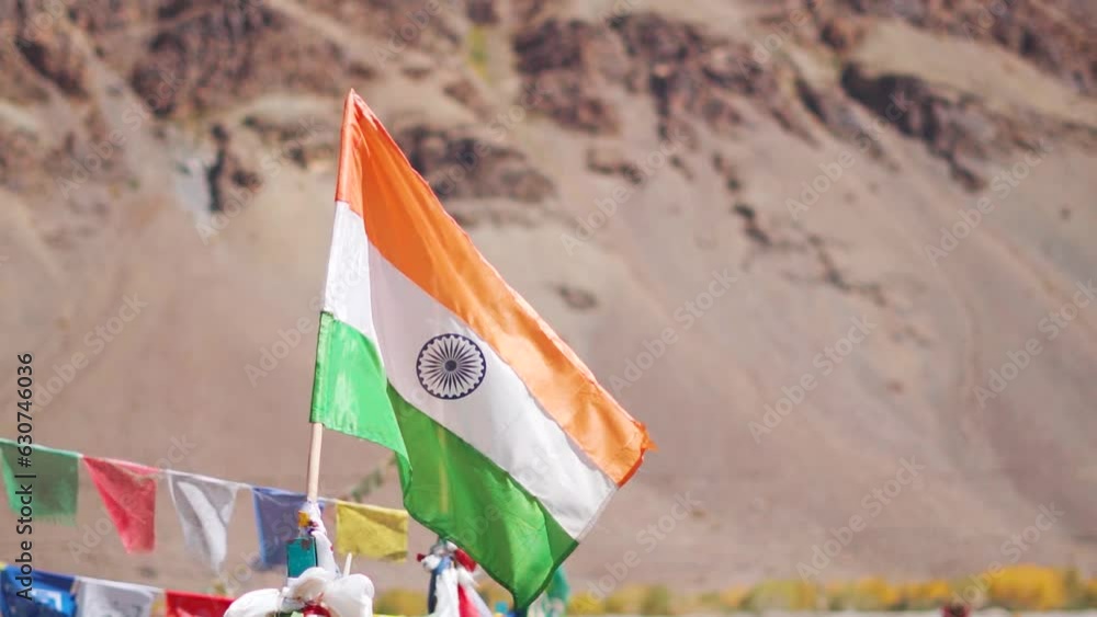 Indian flag waving in front of the Himalayan mountains in Padum town in ...