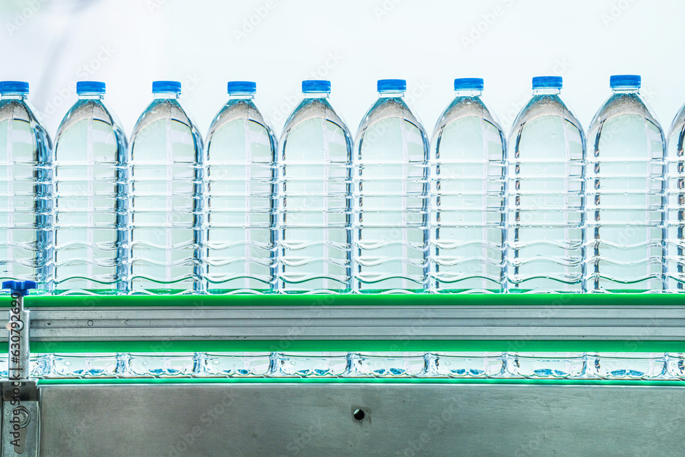 Lots of mineral water bottles in the beverage factory. the clear ...