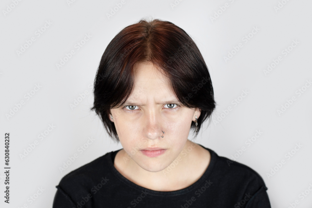 Dramatic portrait of a teenage girl, the girl is a little angry, has a ...