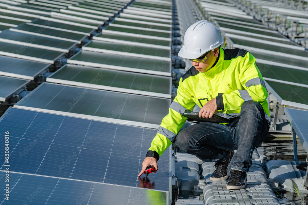 Asian engineer working at Floating solar power plant,Renewable energy ...
