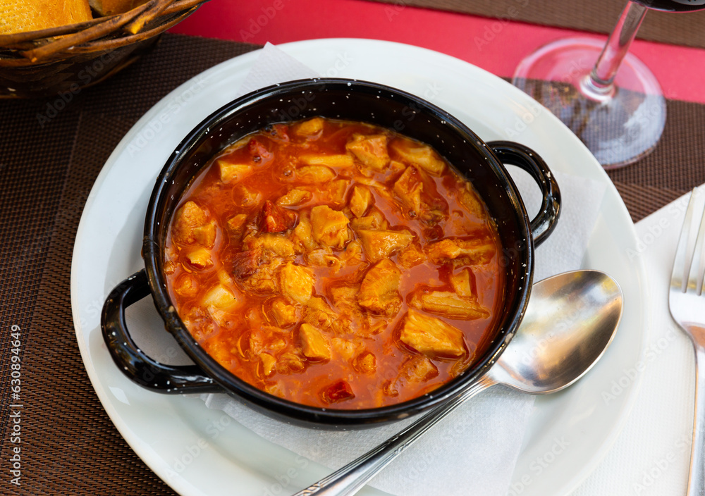 Traditional Spanish hearty and filling stew callos con garbanzos cooked ...
