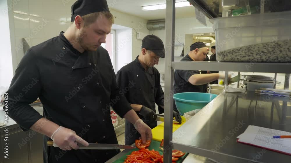Kitchen in the Modern Fast Food Restaurant. Multiple Cooks are ...