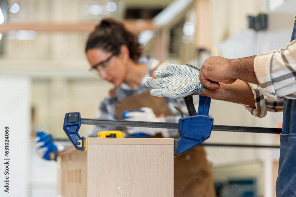 One Strong confident young aged women carpenter standing aim at wood ...