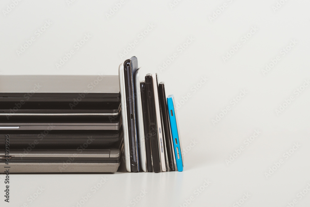 Pile of old used laptop computers, digital tablets, smartphones for ...