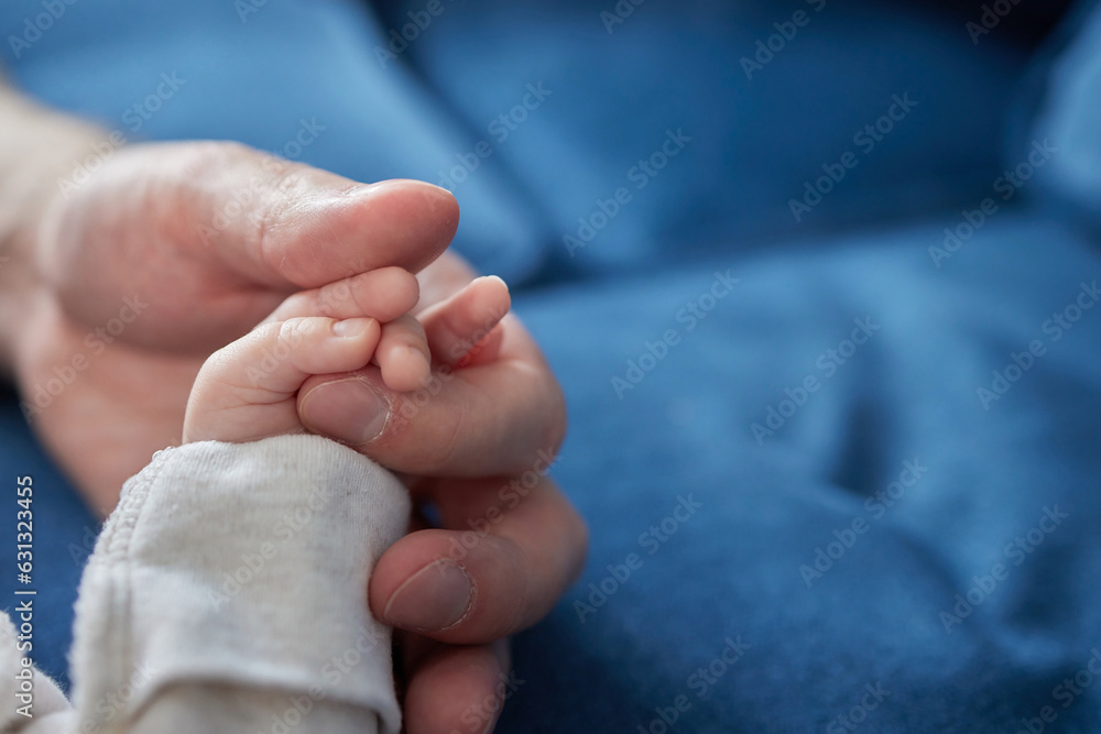 Asian parent hands holding newborn baby fingers, Close up mother's hand ...