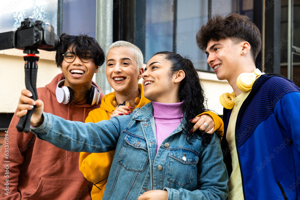 Female college student influencer vlogging with friends outdoors. Group ...