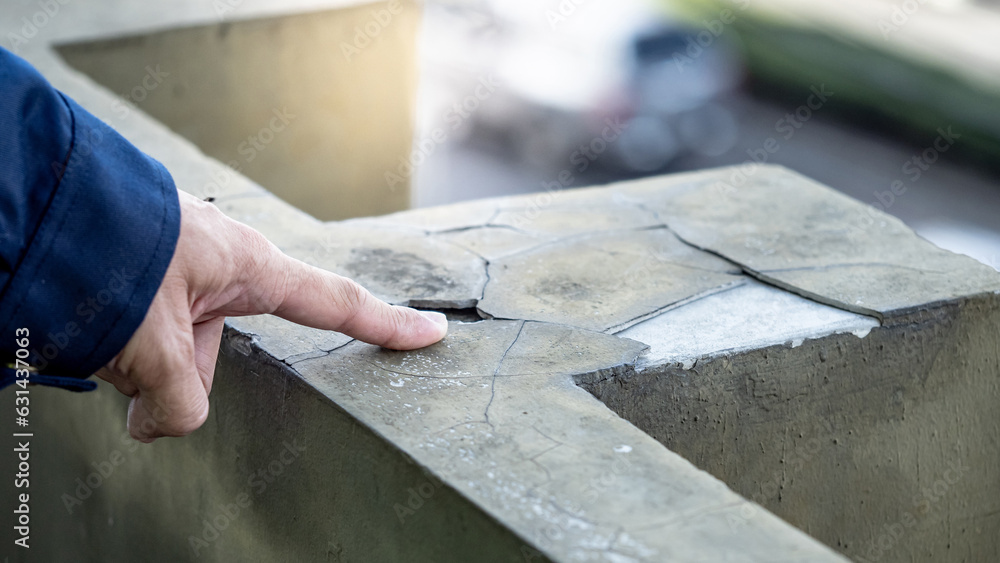Male building inspector or construction worker hand pointing at grunge ...
