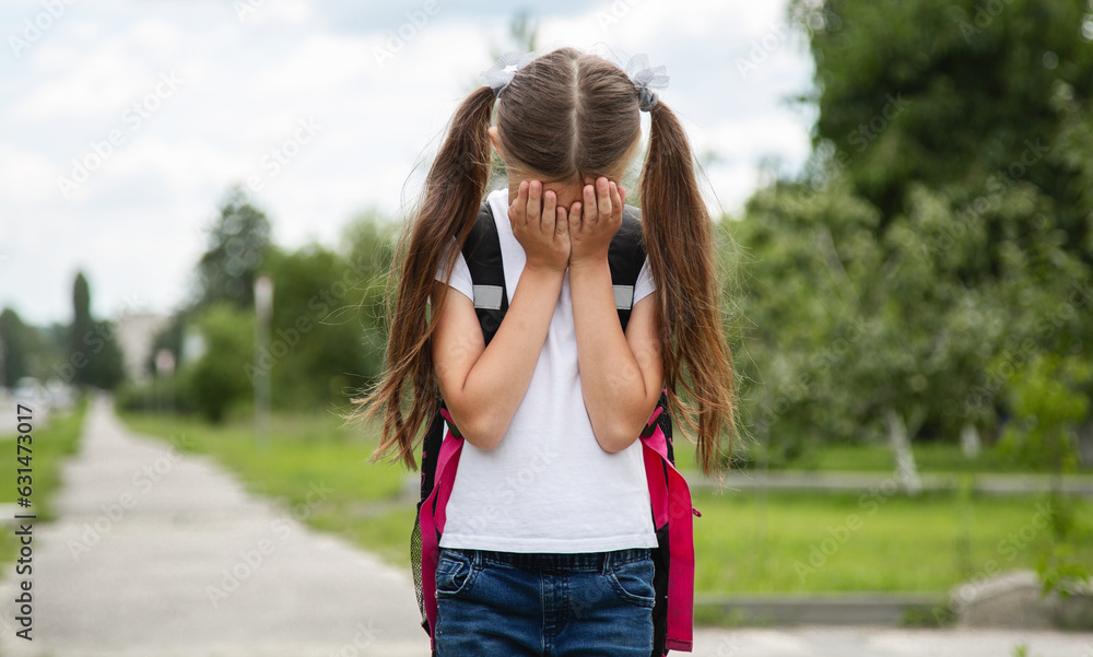 Upset school girl. Back to school. Child girl with backpack has bad ...