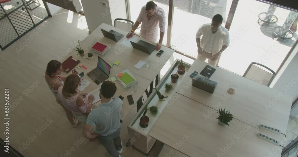 Birds eye view of office work life, diverse people working together ...