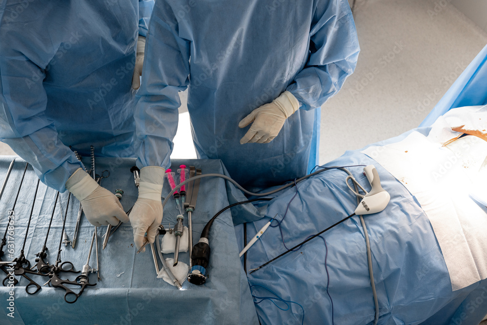 Surgery treatment in progress, view from above on medical tools and ...