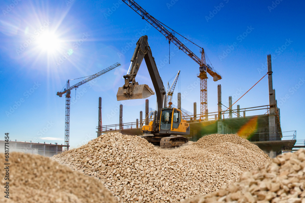 Construction site. Excavator near mountains with rubble. Construction ...