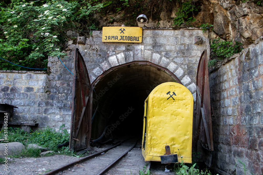 Entry gate to coal mine, leading deep into the earth. Mine shaft of the ...