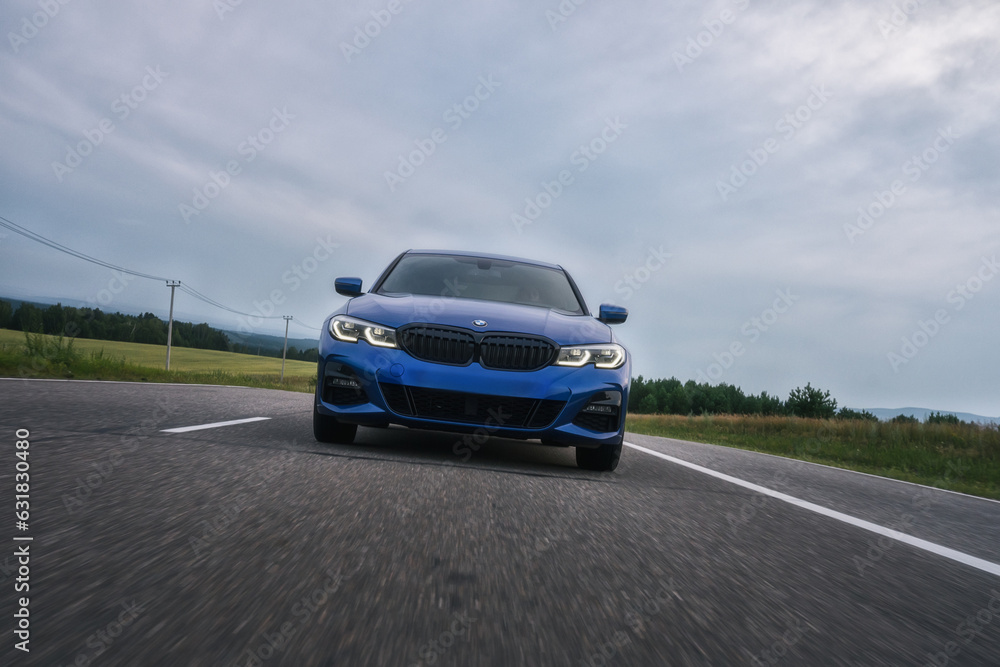 Seattle, Washington, USA, August 4, 2023 BMW 320 blue. the car is on ...