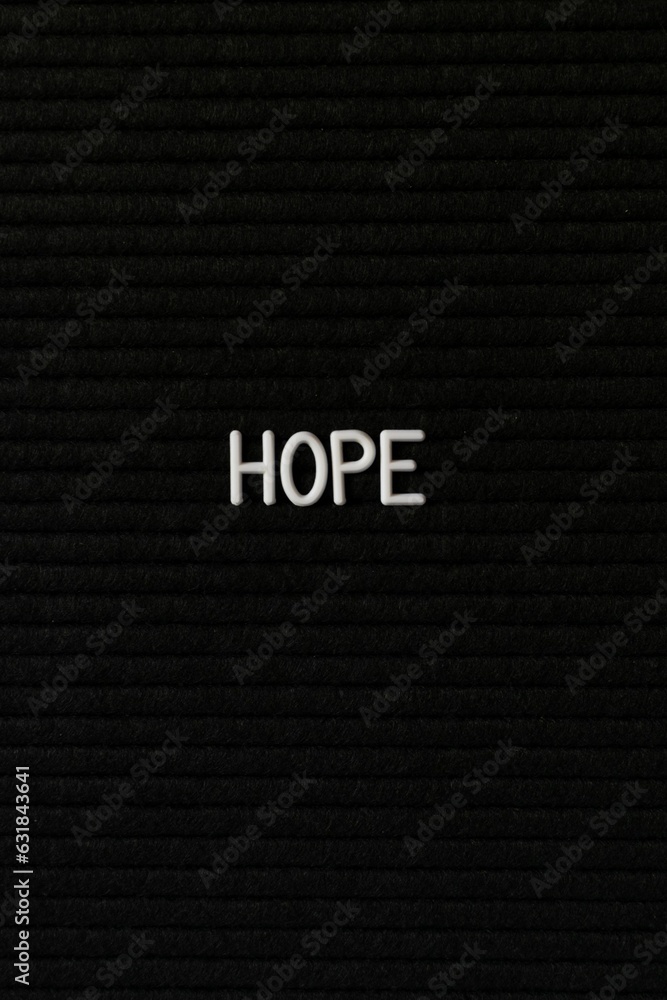 Vertical background about hope with plain white text on a black ...