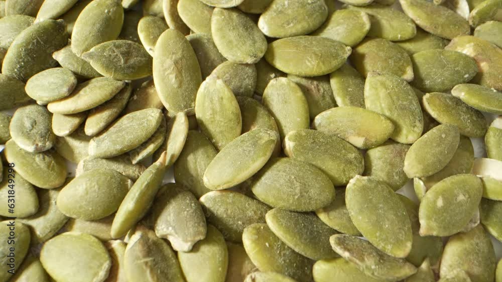 Vídeo do Stock: Vibrant green pumpkin kernels, nature's nutritious gems ...