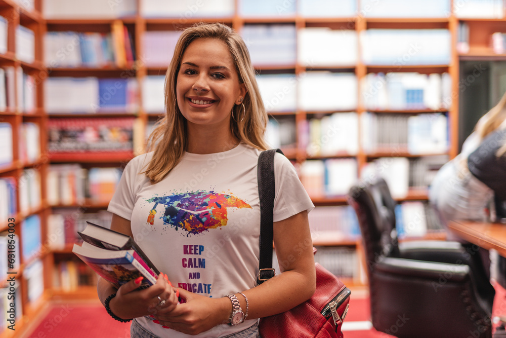 Female student posing for the photo at the library Stock Photo | Adobe ...