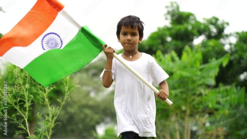 Cute little Indian kids holding, waving or running with Tricolour with ...