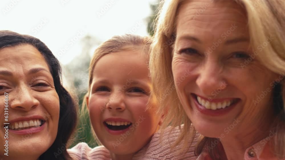 Close up portrait of loving same sex family with two mature mums ...