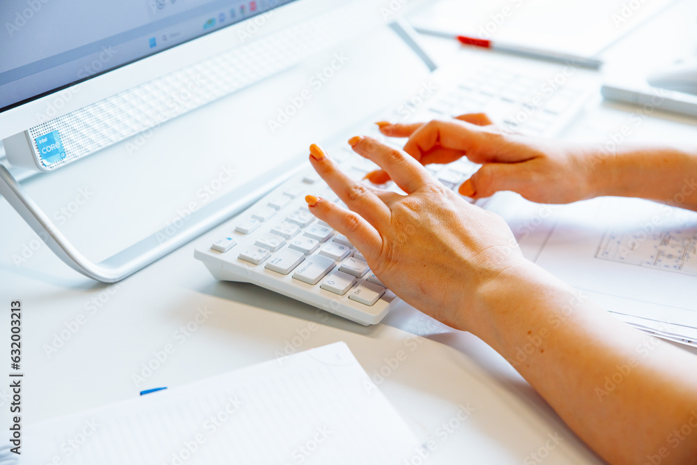female hands typing on keyboard, woman writing letter, iMac. desktop ...