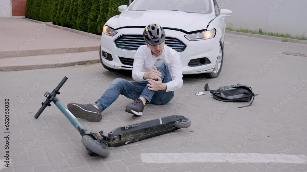 A Man Who Was Going To Work With An Electric Scooter Was Hit By A Car