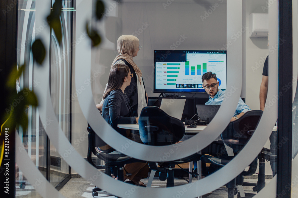 A diverse group of businessmen collaborates and tests a new virtual ...