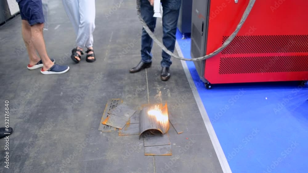 Process of laser cleaning of metal surfaces. Man cleaning surface from ...