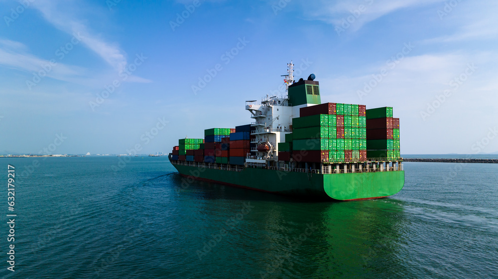 wide angle shot rear view of cargo container ship sailing in sea blue ...