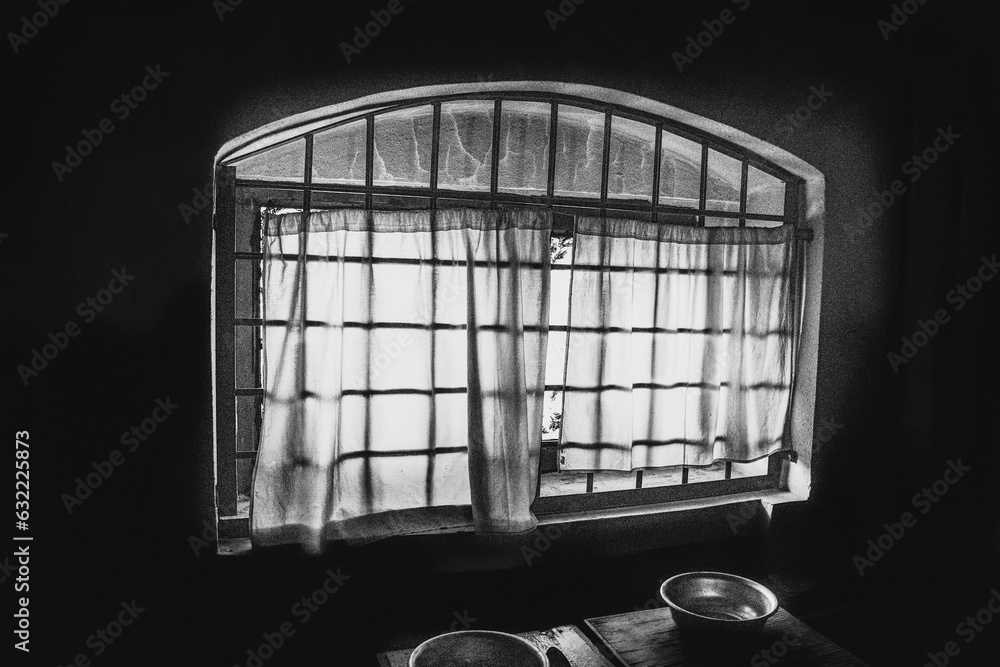 window with bars and shutters, prison window, black and white photo ...