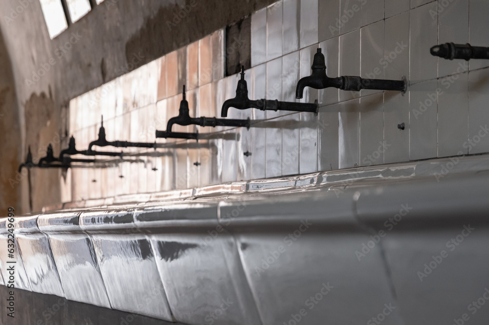 Water taps in washroom in the Small Fortress, which served as a Prague ...