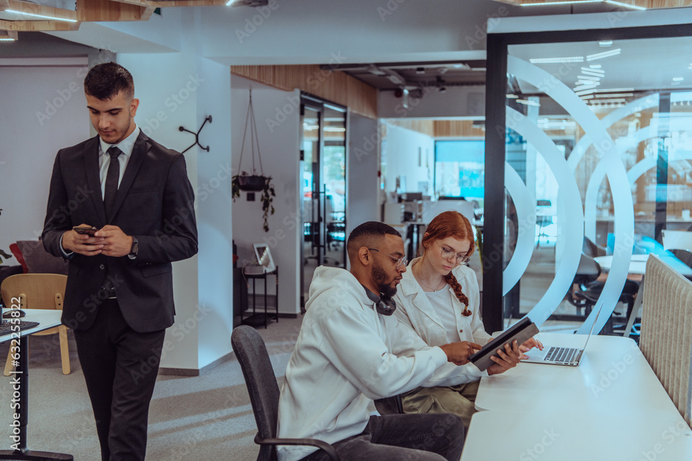 In a modern office setting, an African American businessman and his ...