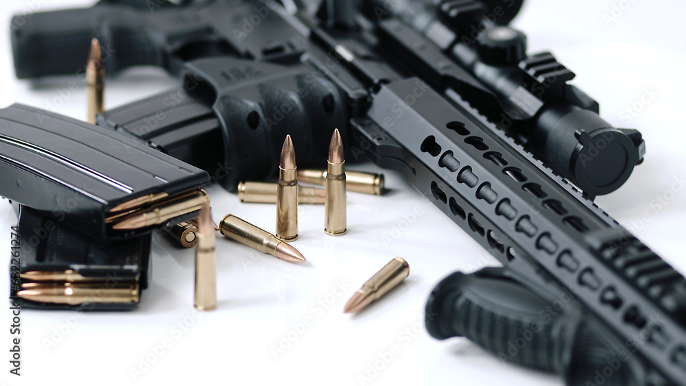 High angle dolly in towards loaded assault rifle with a small amount of ...