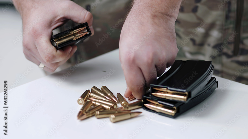 Hand taking ammo, bullets 762 caliber for ak47, gun crime military ...