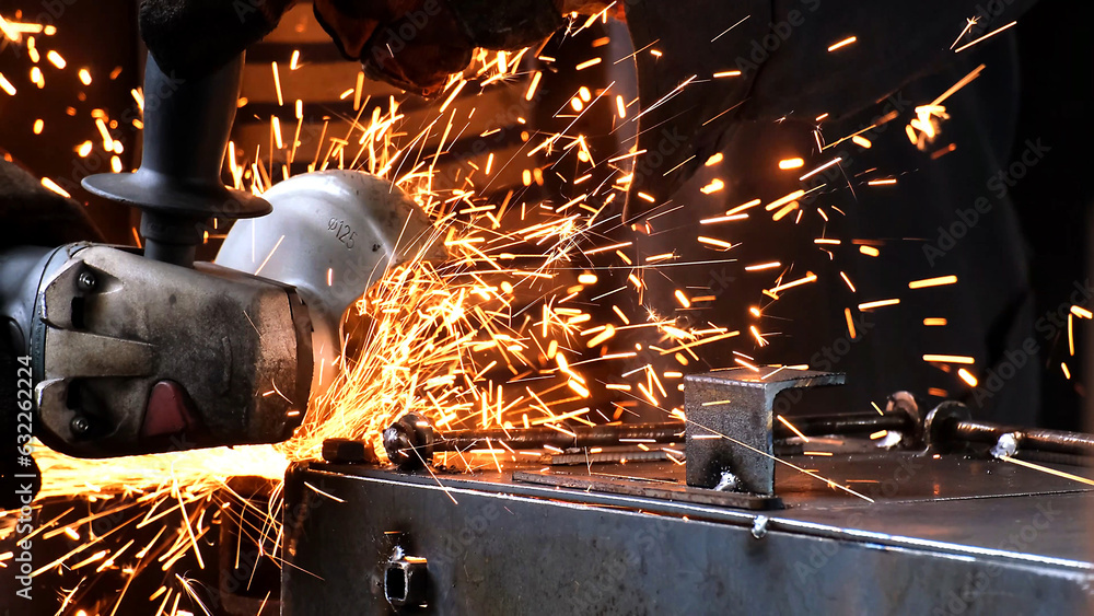 Factory worker welds metal. The man is welding. Welding with argon or ...