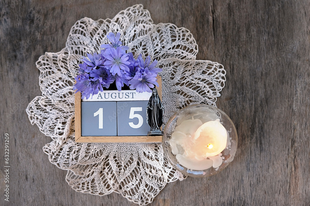 Feast of the Assumption of Mary day, 15th august. Miniature statue of ...