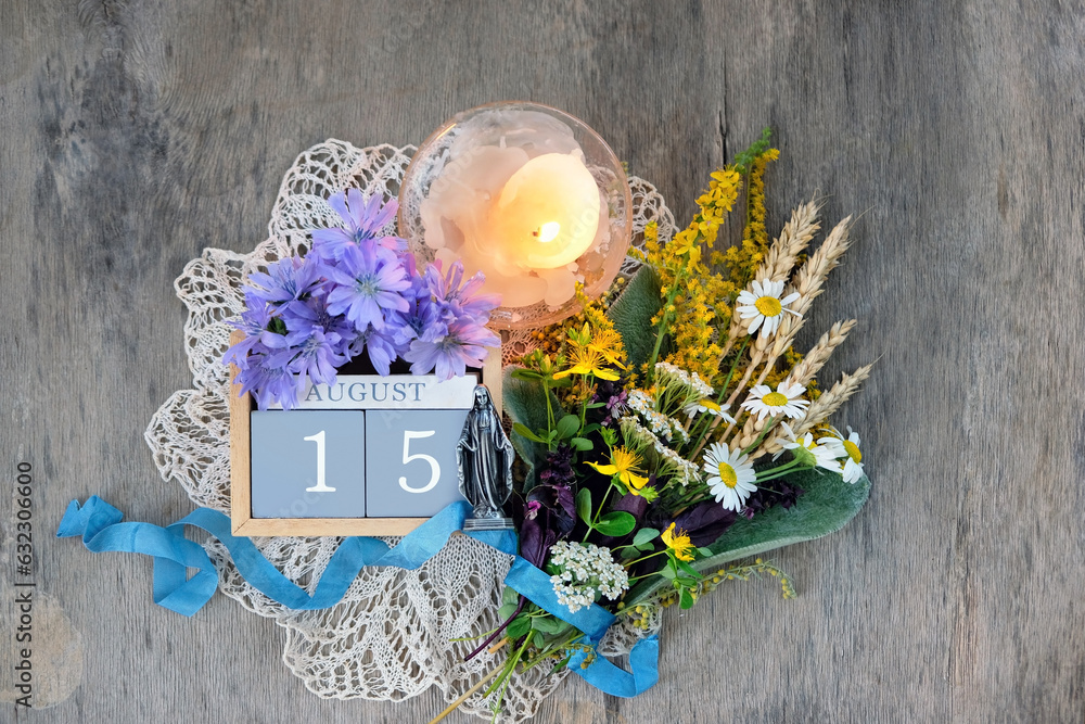 Feast of the Assumption of Mary day, 15th august. Miniature statue of ...