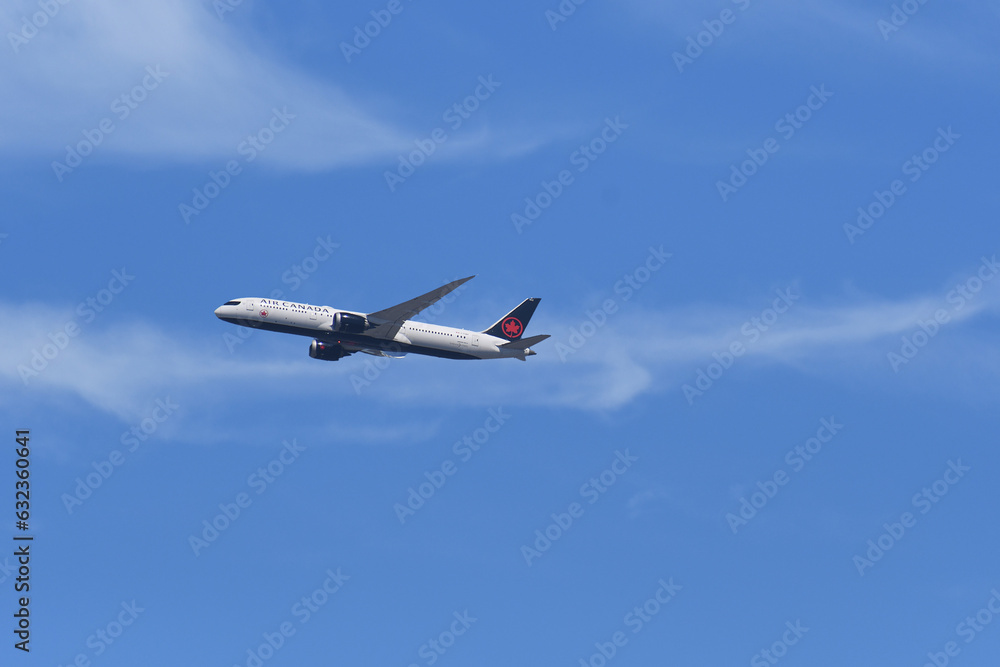 Air Canada taking off under a blue sky Stock Photo | Adobe Stock