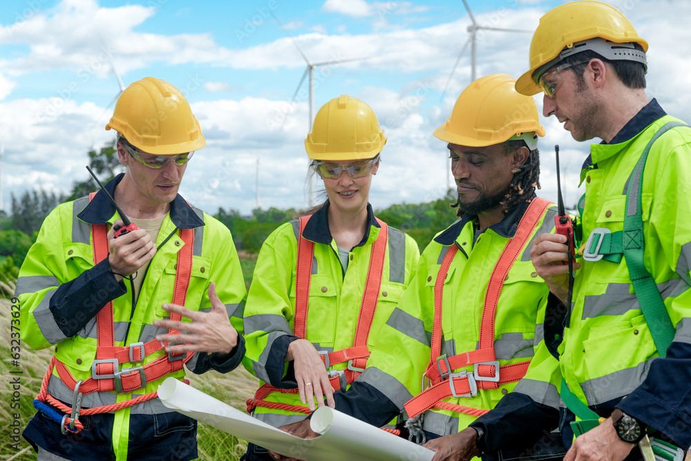 Smart professional engineers working in fieldwork outdoor. Workers ...