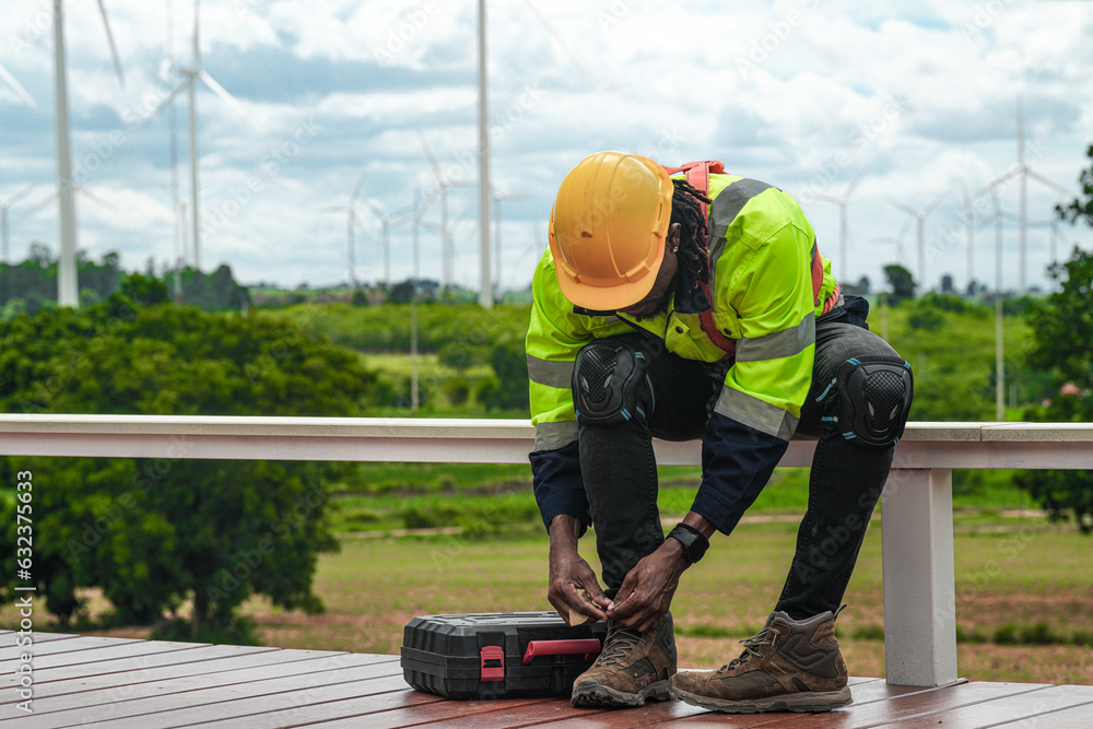 African Engineers man wearing safety shoes before walking on ...