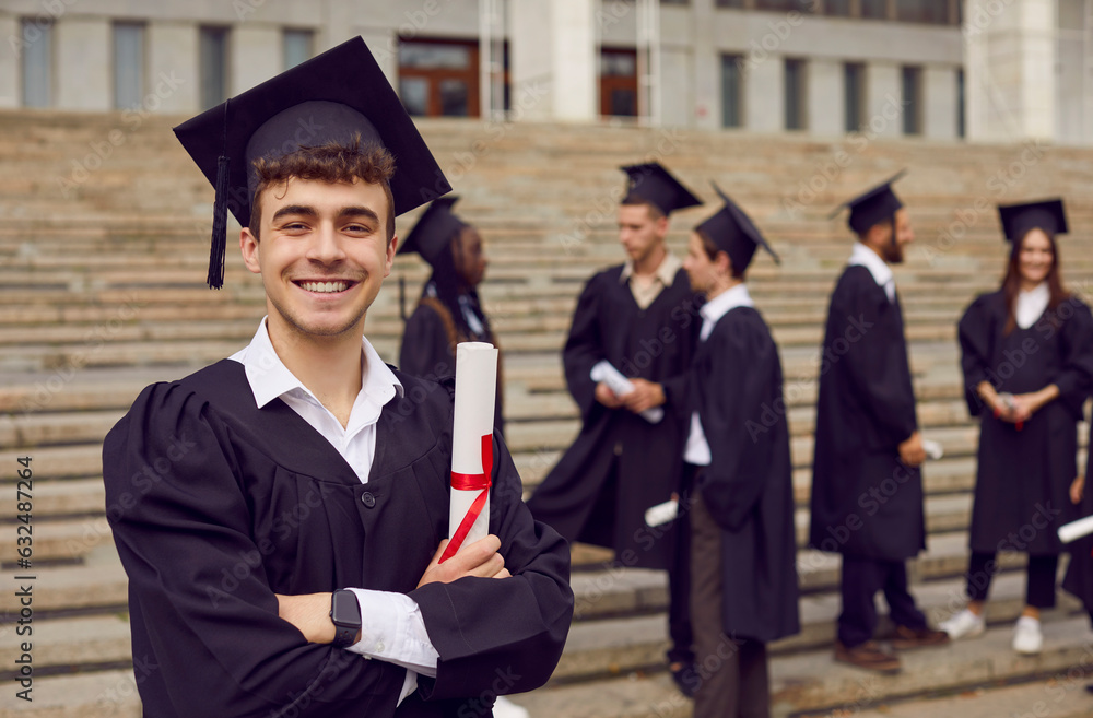 Happy male student on graduation day. Portrait of a young man in a ...