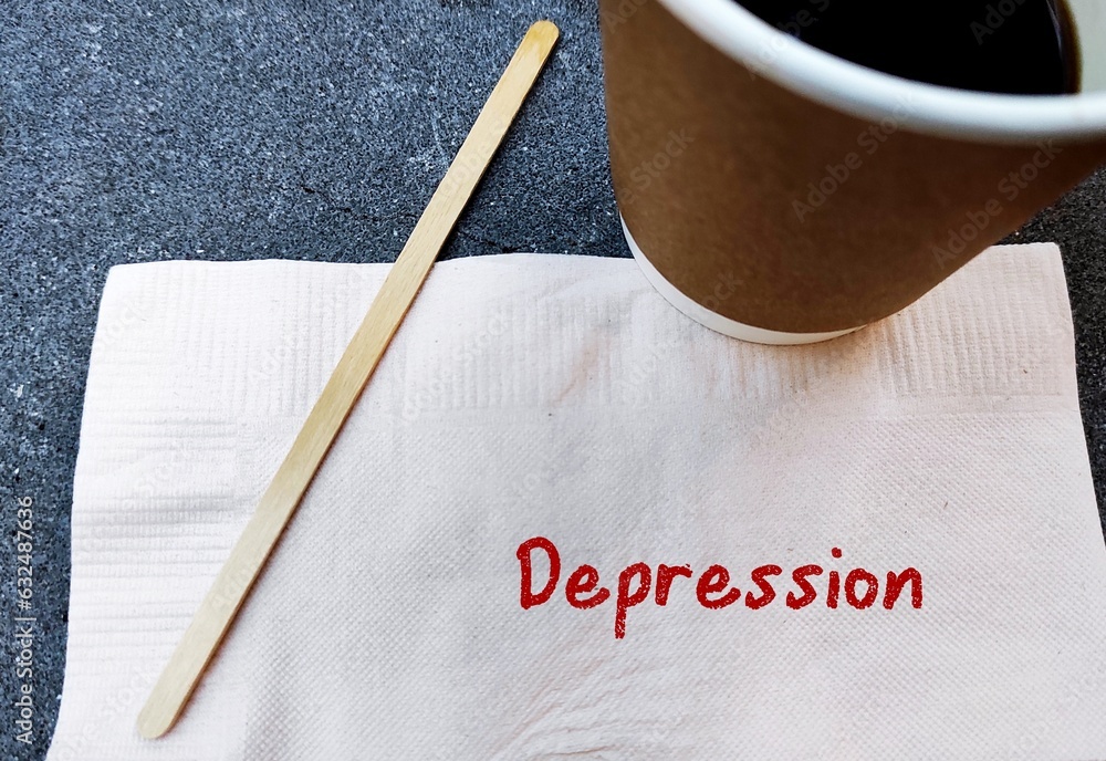Coffee cup and hand written text on paper napkin DEPRESSION, concept of ...