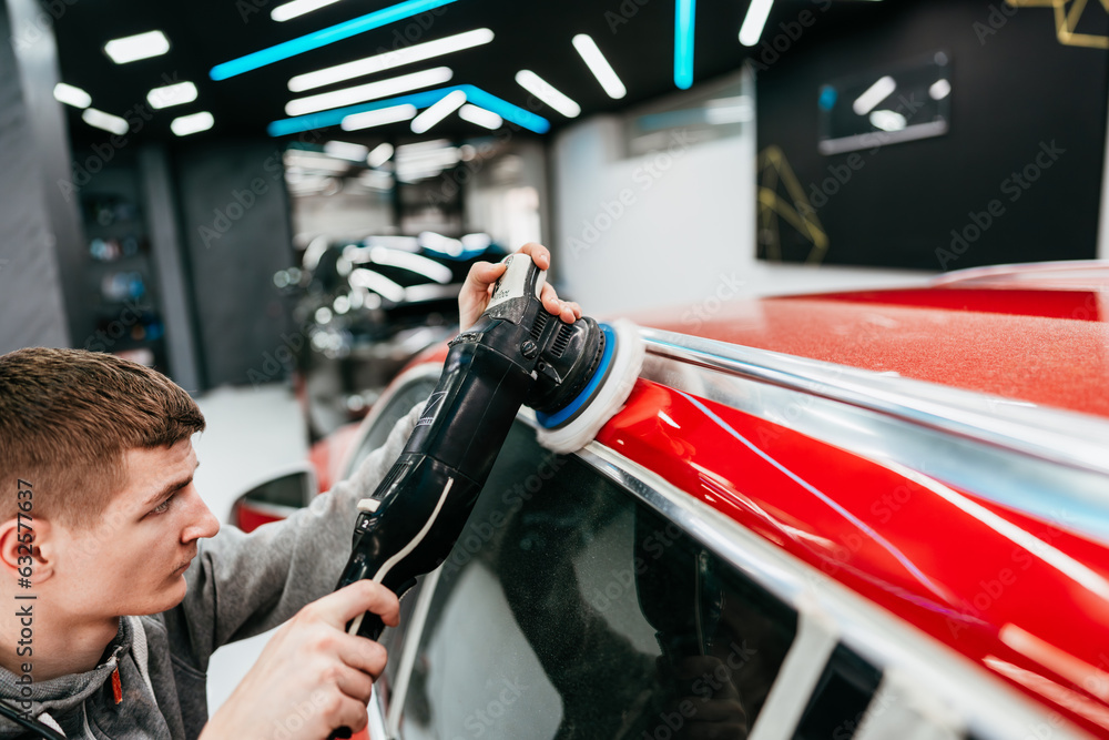 Professional vehicle polishing and detailing service in a modern car ...