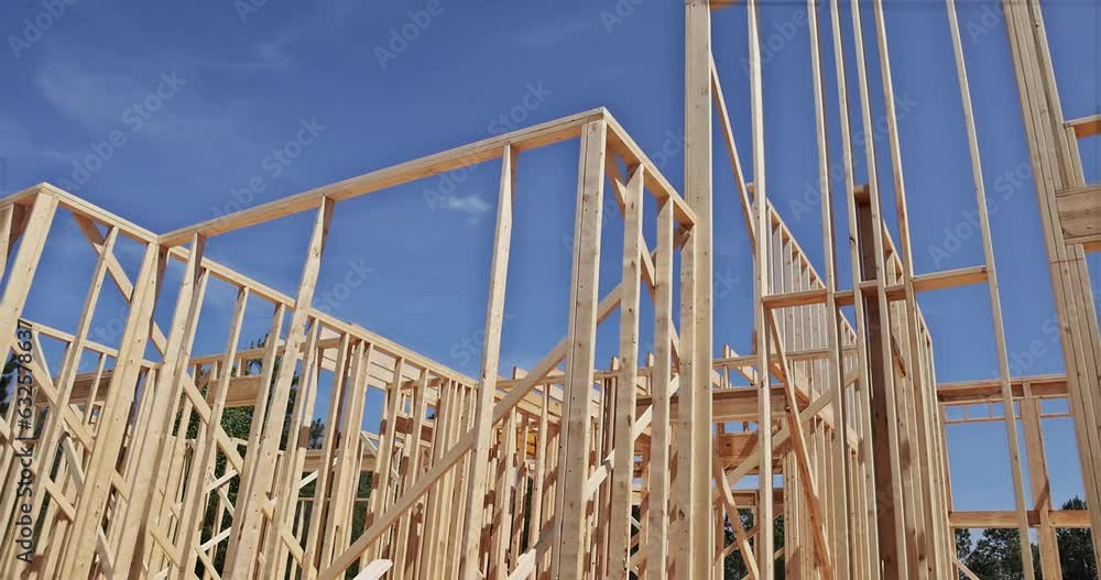 House with wooden framework frame is being constructed with support ...