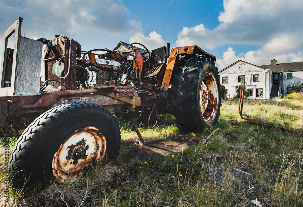 Old tractor with missing body parts as rusty engine and mechanical ...