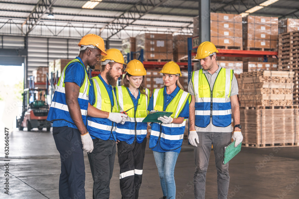 Multinational workers group working together in uniform, helmet ...